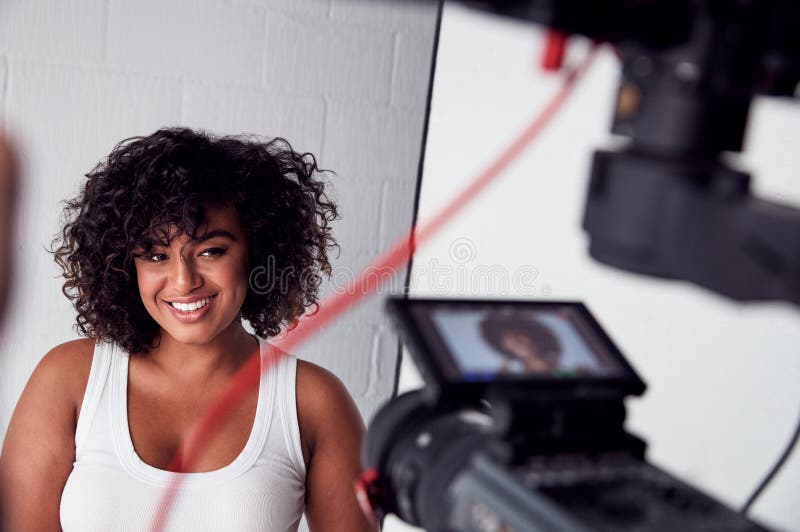 Female Model Posing for Video Camera on Film Set Stock Image - Image of ...