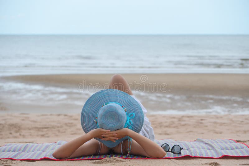 A Female Model Relaxing on Beach by Sea Stock Image - Image of resting ...