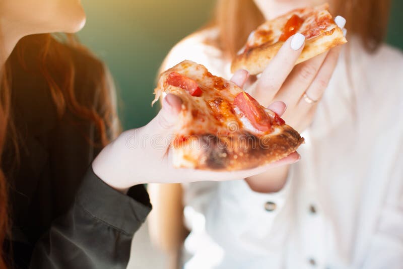 Female Models Hold a Piece of Pizza in Hand. Pizza in Hand Close-up ...