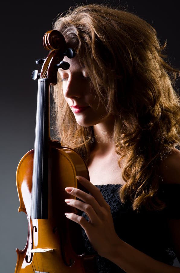 The Female Musical Player Against the Dark Stock Image - Image of ...