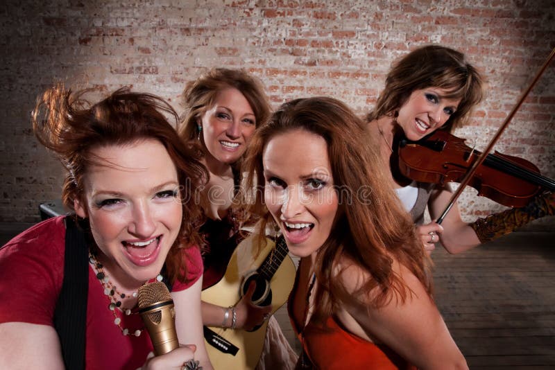 Female musicians stock photo. Image of pretty, bricks - 15245360
