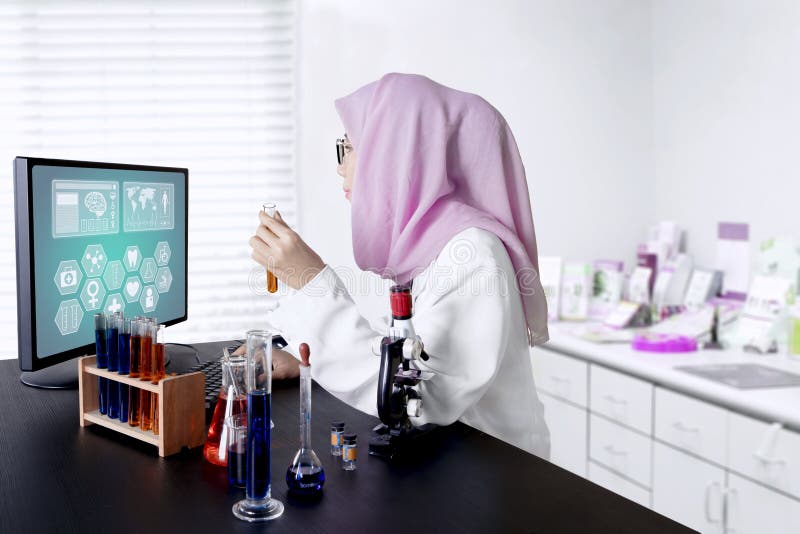 Muslim Scientist Analyzing Chemical Liquid on Studio Stock Photo ...