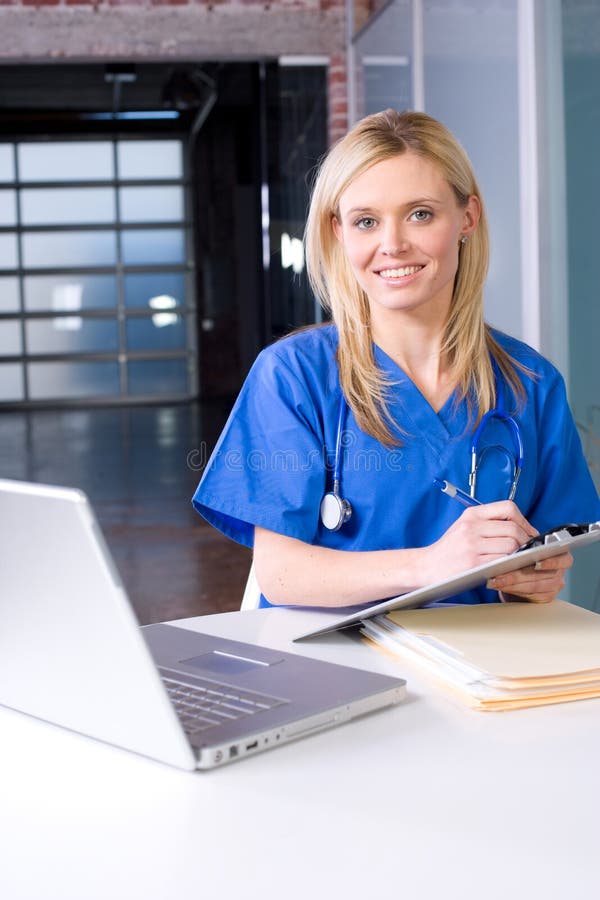 Female nurse at a desk stock photo. Image of beautiful - 8593926