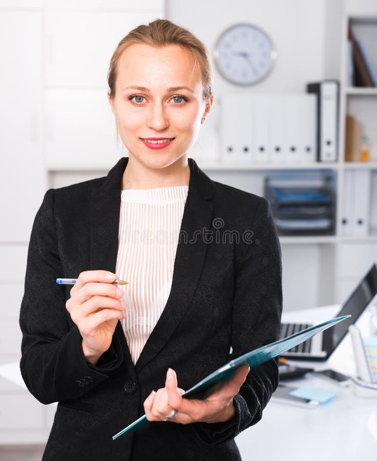 Female in the Office Standing with Folder Stock Photo - Image of ...