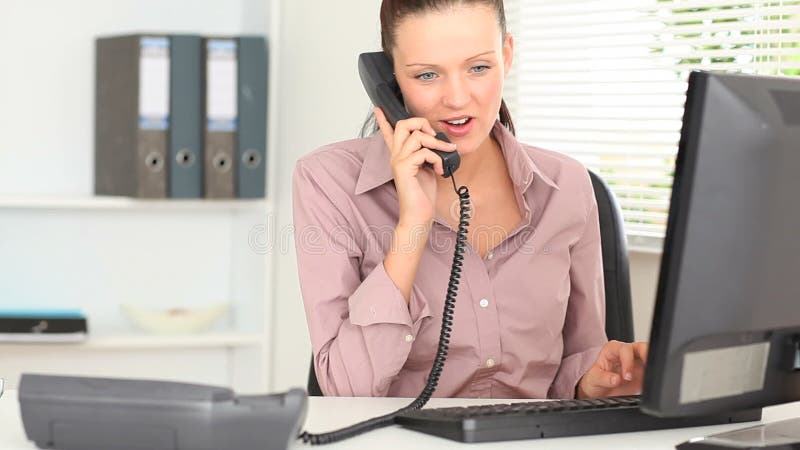 Female Office Worker Answering the Phone Stock Footage - Video of call ...