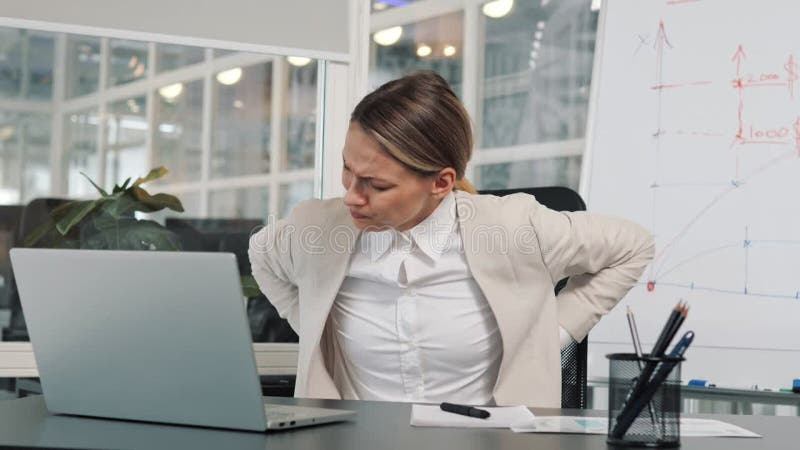 Female Office Worker Boss Working on Laptop while Feeling Strong Pain ...