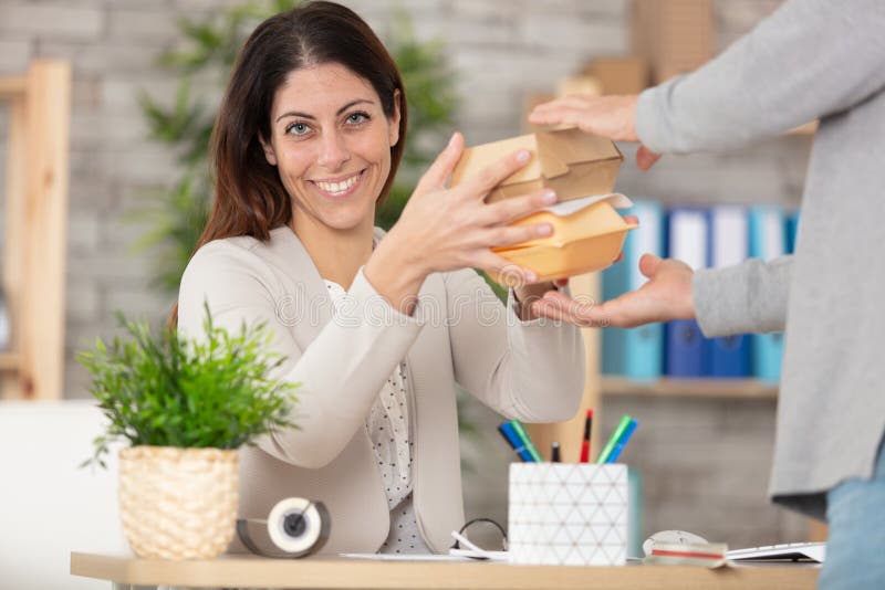 Female Office Worker Gettting Meal Delivered at Work Stock Photo ...