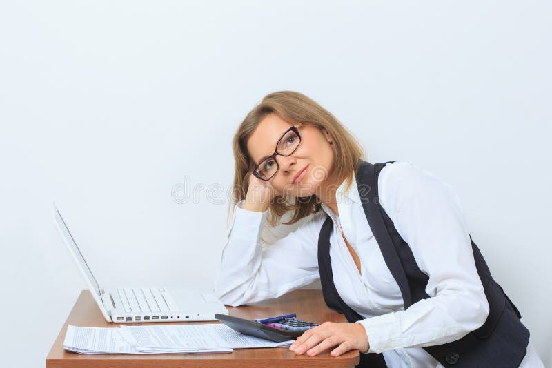 Female Office Worker Sits at Her Desk and Look Stock Photo - Image of ...