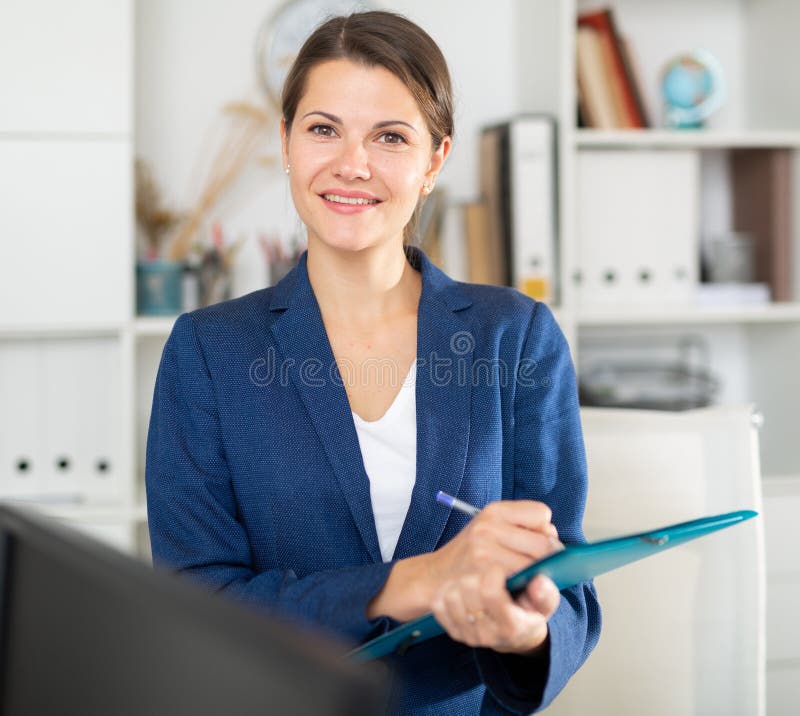 Female Office Worker is Standing with Documents before Signing Stock ...