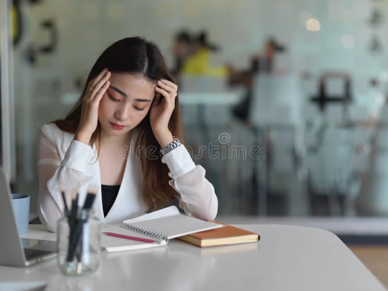 Female Office Worker Thinking about Her Work while Sitting at Worktable ...