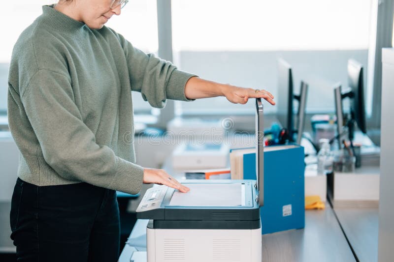 Female Office Worker Using the Printer at the Office Stock Photo ...