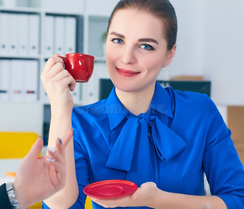 Female Office Workers Sitting at the Table and Speaking and Drinking ...