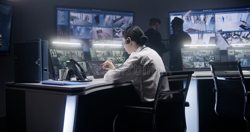Female Officer Controls CCTV Cameras Using Tablet Stock Photo - Image ...