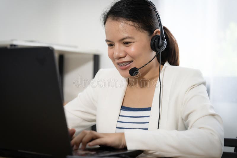 Beautiful Female Call Center Operator Wearing Headset Typing Laptop ...