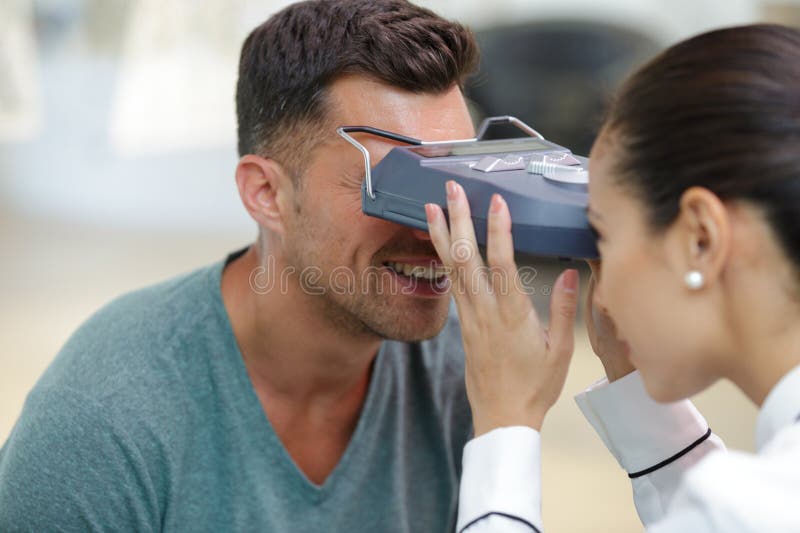 Female Optometrist Doing Sight Testing for Patient Stock Image - Image ...