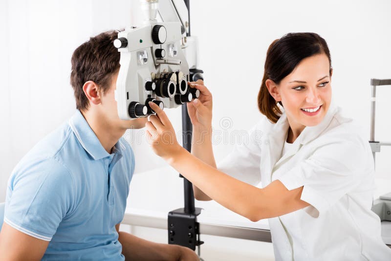 Female Optometrist Doing Sight Testing for Patient Stock Image - Image ...