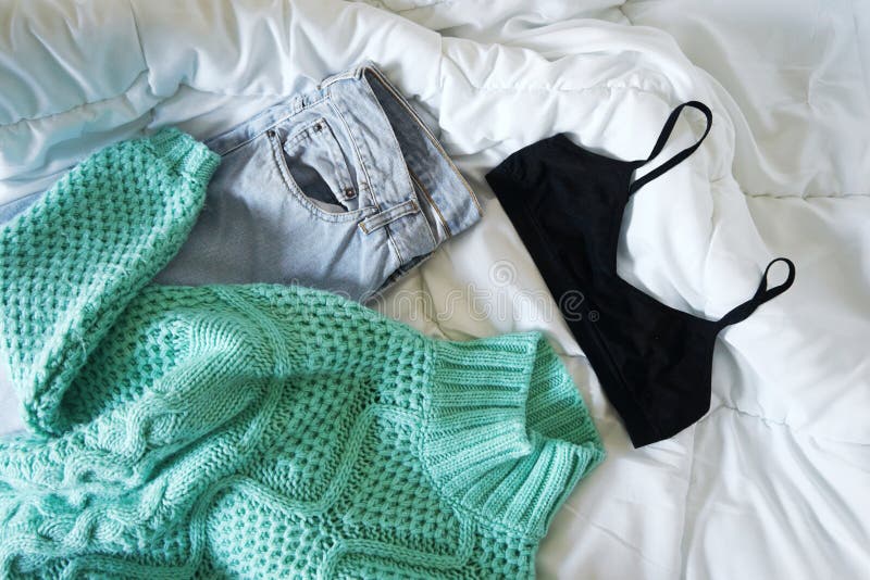 Female Outfit Laid Out on Bed Stock Photo - Image of concept, shirt ...