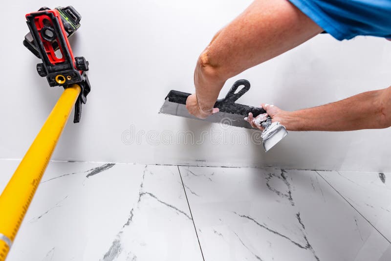 Female Painter Applying Putty To Ceiling. Stock Photo - Image of ...