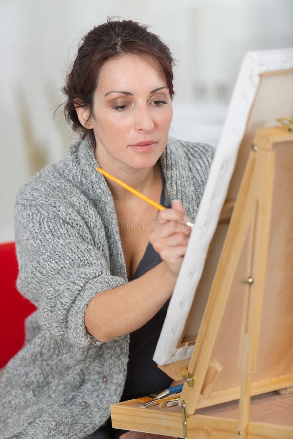 Female Painter Drawing in Art Studio Using Easel Stock Image - Image of ...