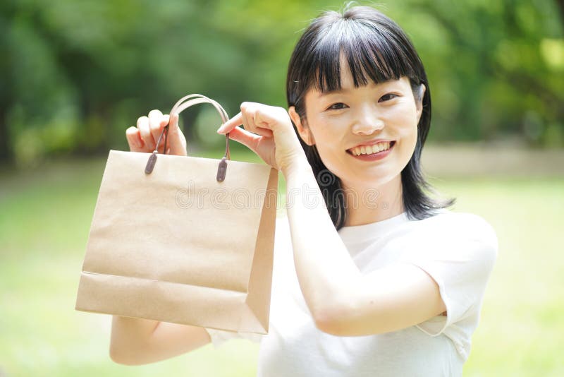 Female with a paper bag stock image. Image of child - 238933007