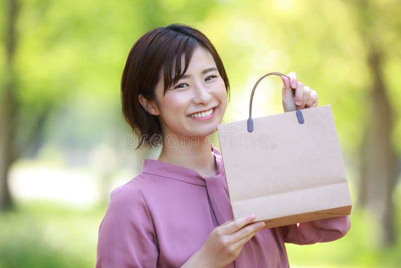 Female with a paper bag stock photo. Image of pink, worker - 238939966