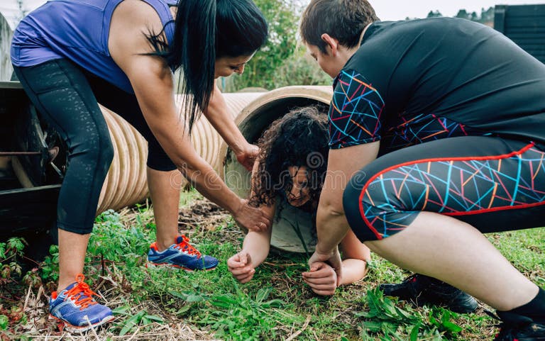 Participants Obstacle Course Going through a Pipe Stock Photo - Image ...