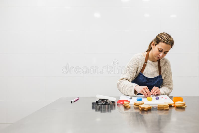 Female Pastry Chef Preparing Cookies on the Kitchen Table of the Pastry ...