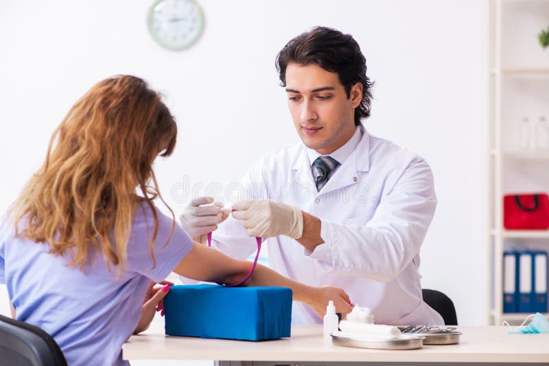 The Female Patient during Blood Test Sampling Procedure Stock Photo ...