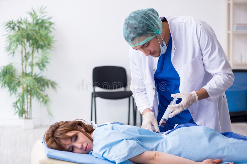 Female Patient Getting an Injection in the Clinic Stock Image - Image ...