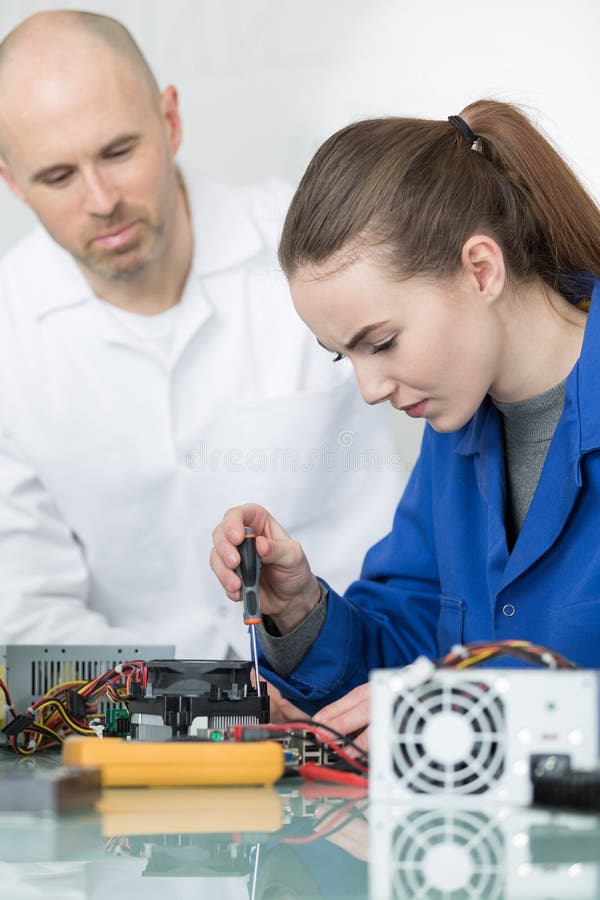 Female Pc Technician Soldering Chip from Desktop Computer Stock Photo ...
