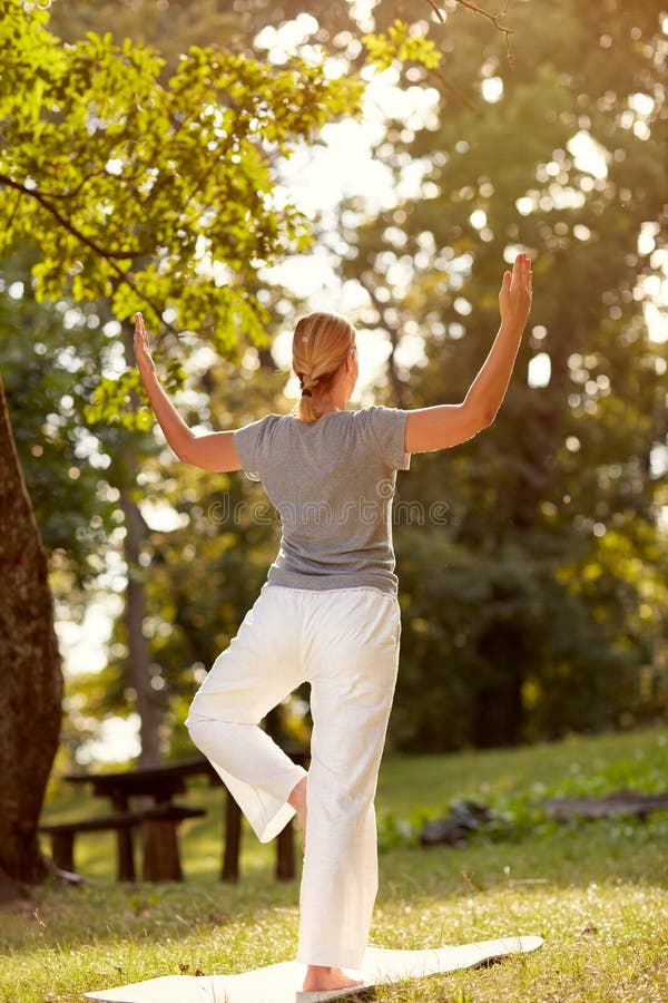 Female Person Doing Body Balance Exercise in Park, Back View Stock ...