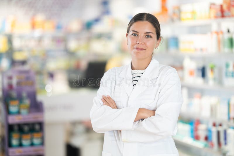 Female Pharmacist in Medical Uniform Posing while Working in Pharmacy ...