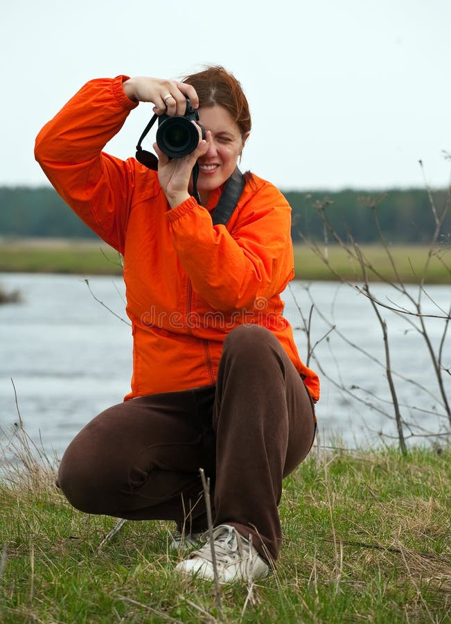 Female Photographer Against Nature Stock Photo - Image of hold ...