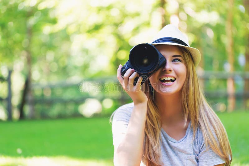 Female Photographer with a Camera Outside Stock Photo - Image of girl ...