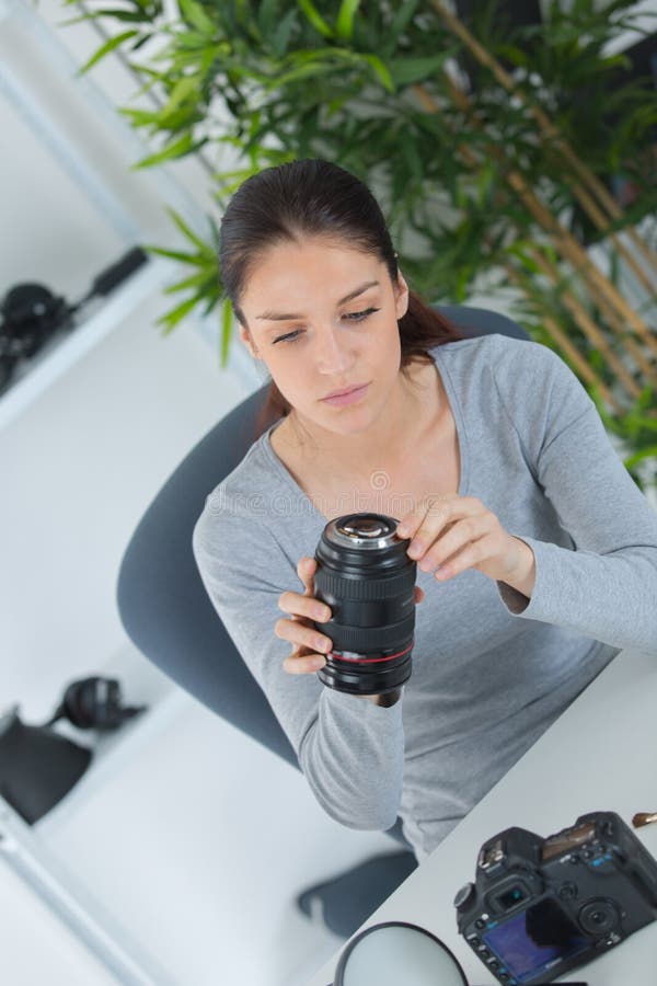 Female Photographer Checking Lens Stock Photo - Image of camera, device ...