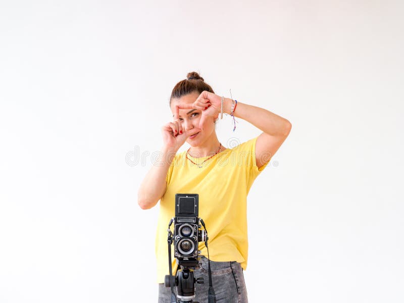 A Female Photographer Frames a Scene with Her Hands and Fingers. Stock ...