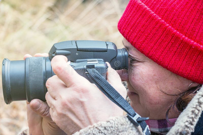 Female Photographer Looking in Viewfinder Stock Image - Image of ...