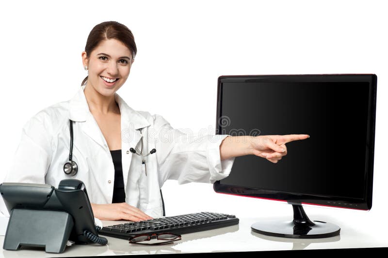 Female Physician Pointing at Computer Screen Stock Image - Image of ...