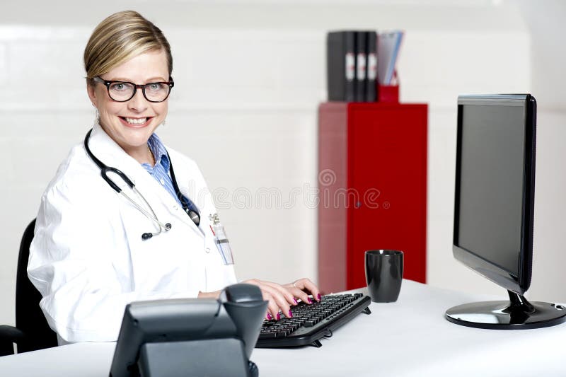 Female Physician Using Computer Stock Photo - Image of care, cheerful ...