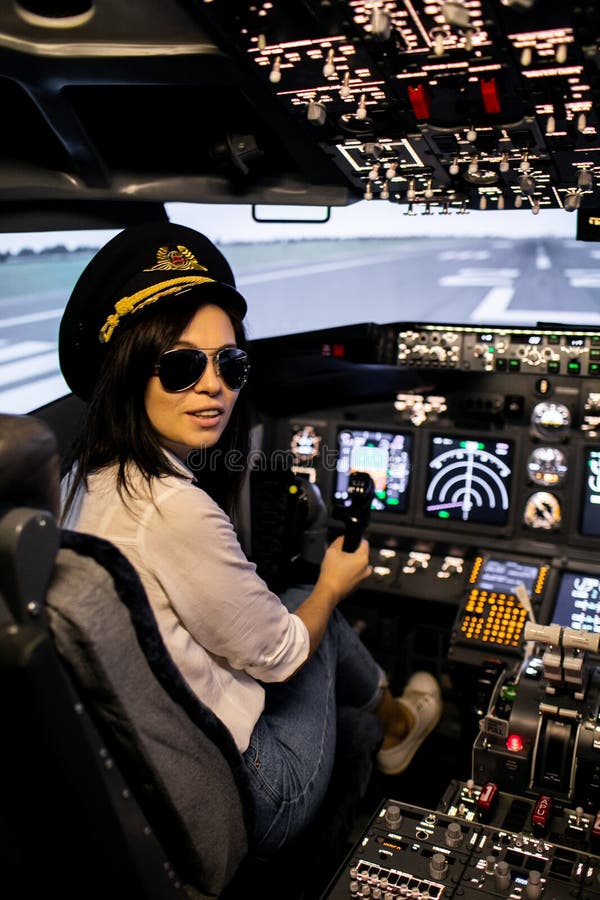 Female Pilot the Captain of the Plane Prepares for Take-off in the ...