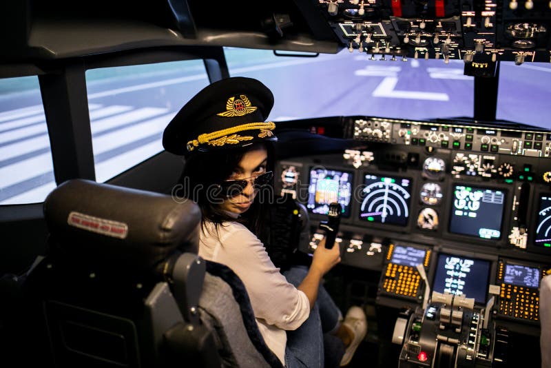 Female Pilot the Captain of the Plane Prepares for Take-off in the ...