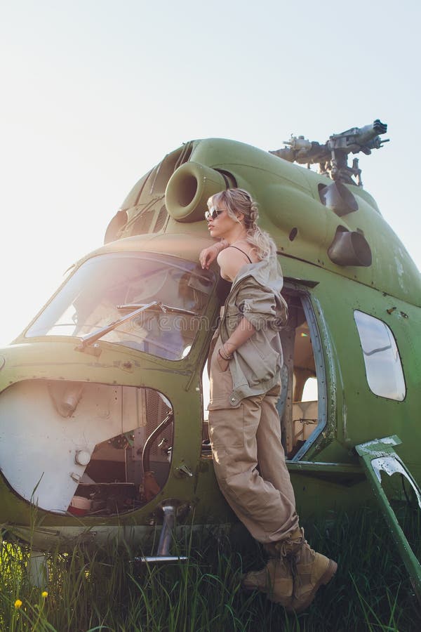 Female Pilot in Cockpit of Helicopter before Take Off. Young Woman ...