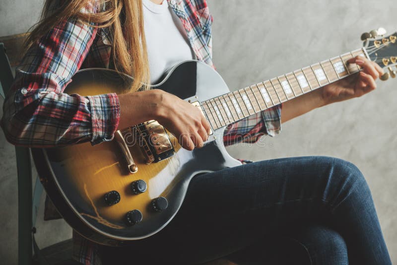 Female playing the guitar stock photo. Image of model - 91026384