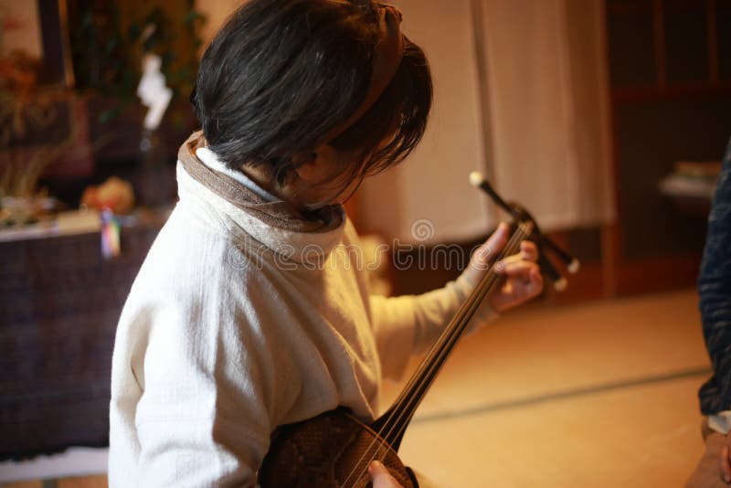 Female playing the sanshin stock photo. Image of holidays - 241187202
