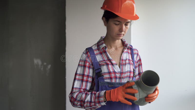 Plumber Woman Installing Pvc Sewer Pipes at Home or Construction Site ...