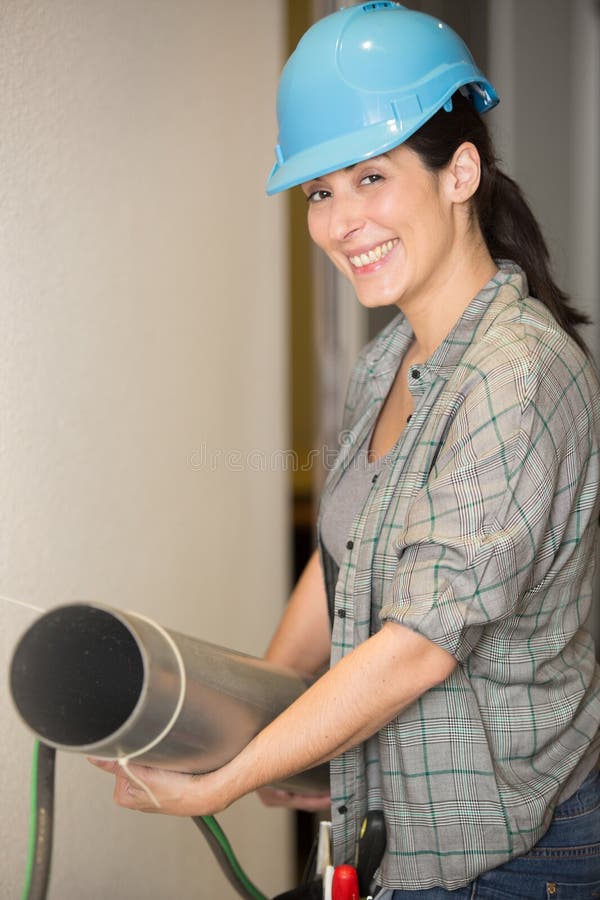 Female Plumber Looking at Camera Stock Photo - Image of home, help ...