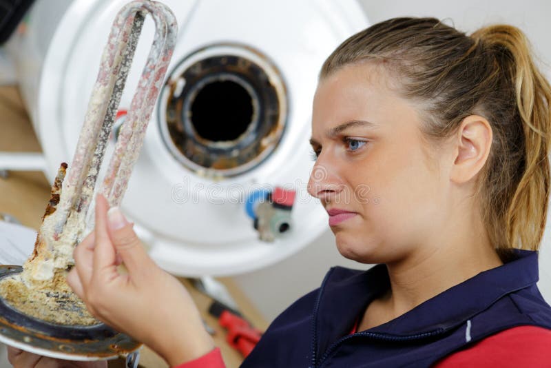 Female Plumber Working on Central Heating Boiler Stock Image - Image of ...