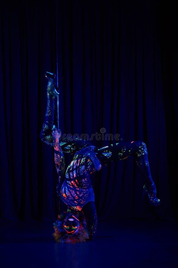 Female Pole Dancer in Bright Neon Colours Under Ultraviolet Stock Photo ...