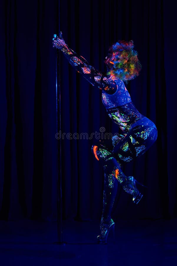 Female Pole Dancer in Bright Neon Colours Under Ultraviolet Stock Image ...