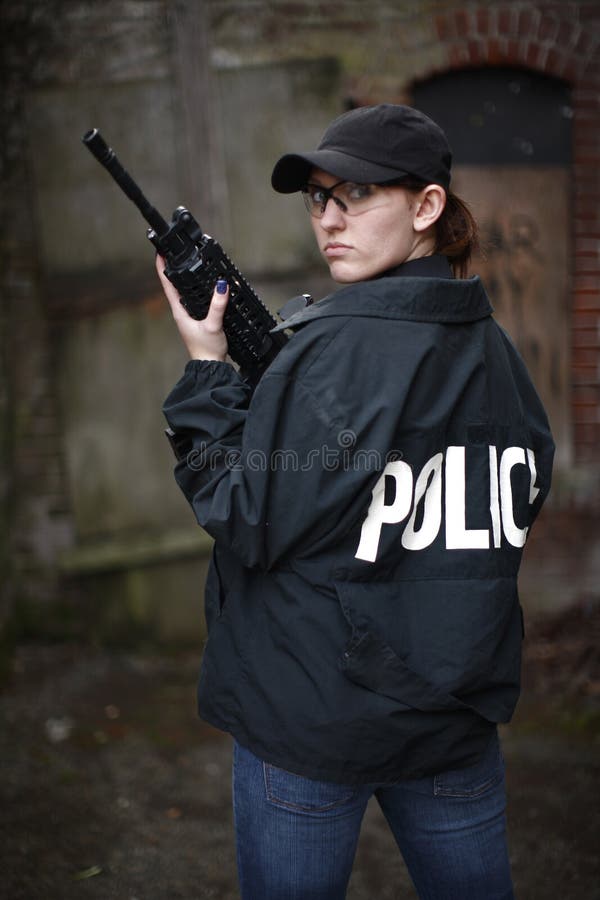 Female Police Officer with Rifle Stock Photo - Image of jeans, firearm ...